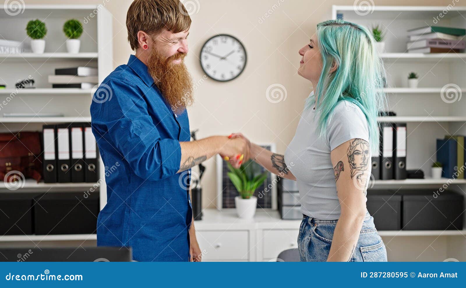 Man and Woman Business Workers Shake Hands Smiling at Office Stock ...