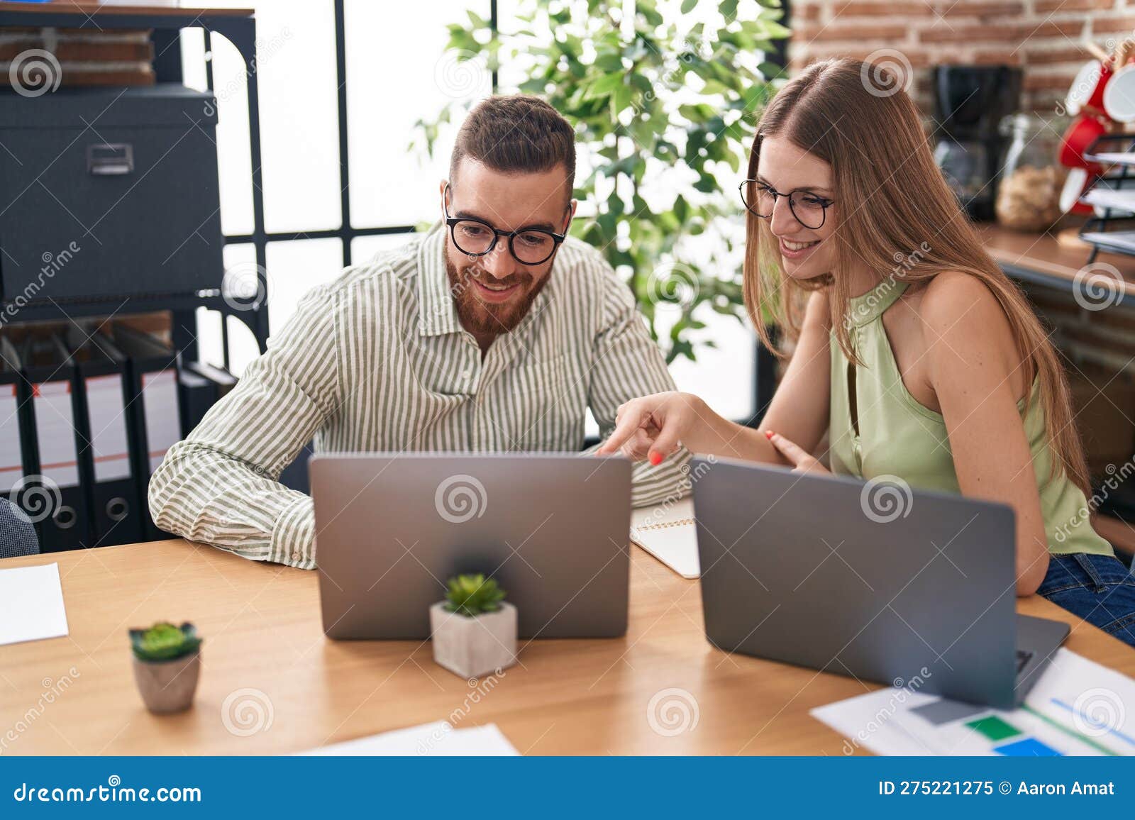 Man and Woman Business Workers Using Laptop Speaking at Office Stock ...