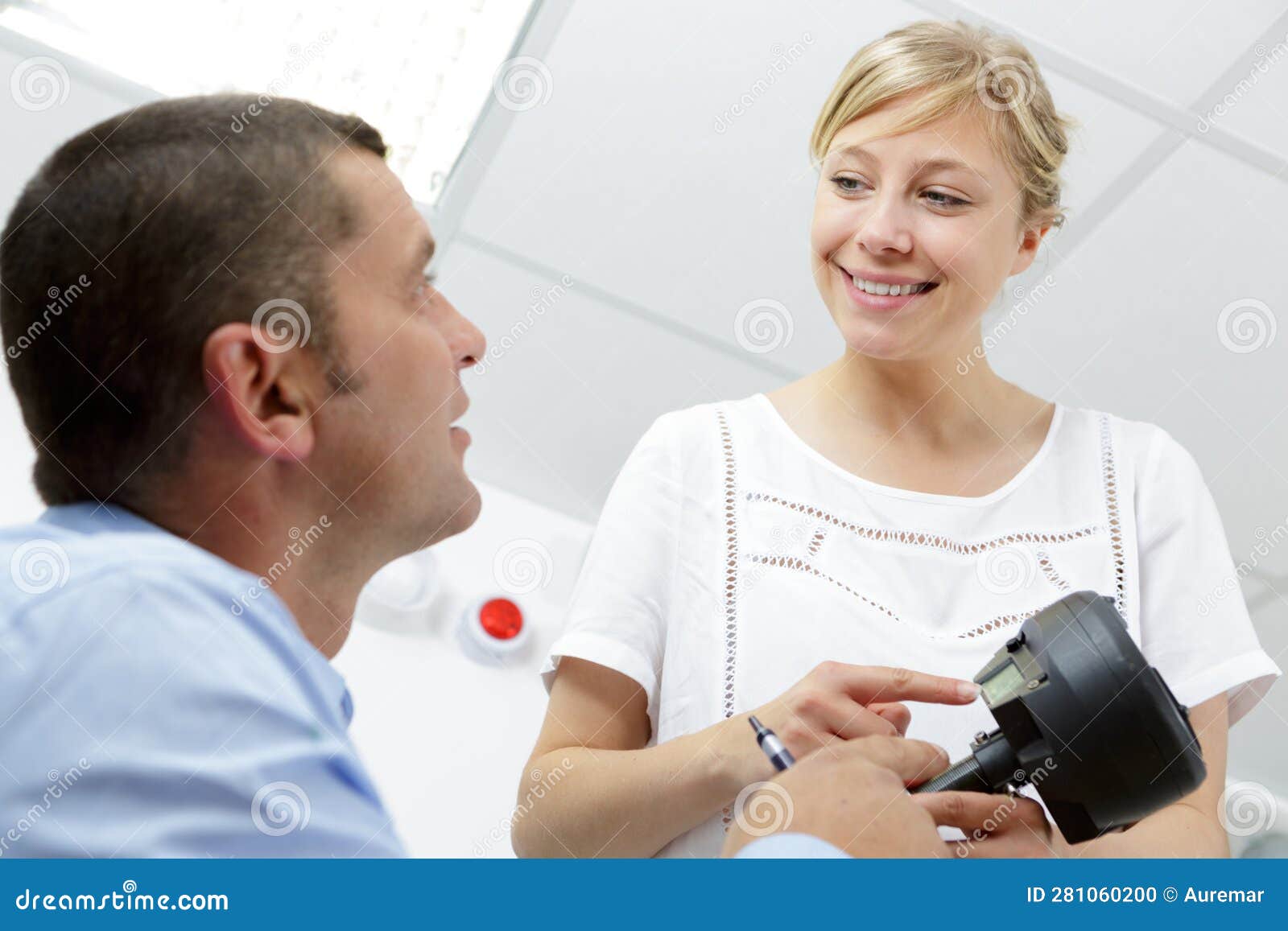 Man and Woman Checking Device Operational Stock Photo - Image of ...