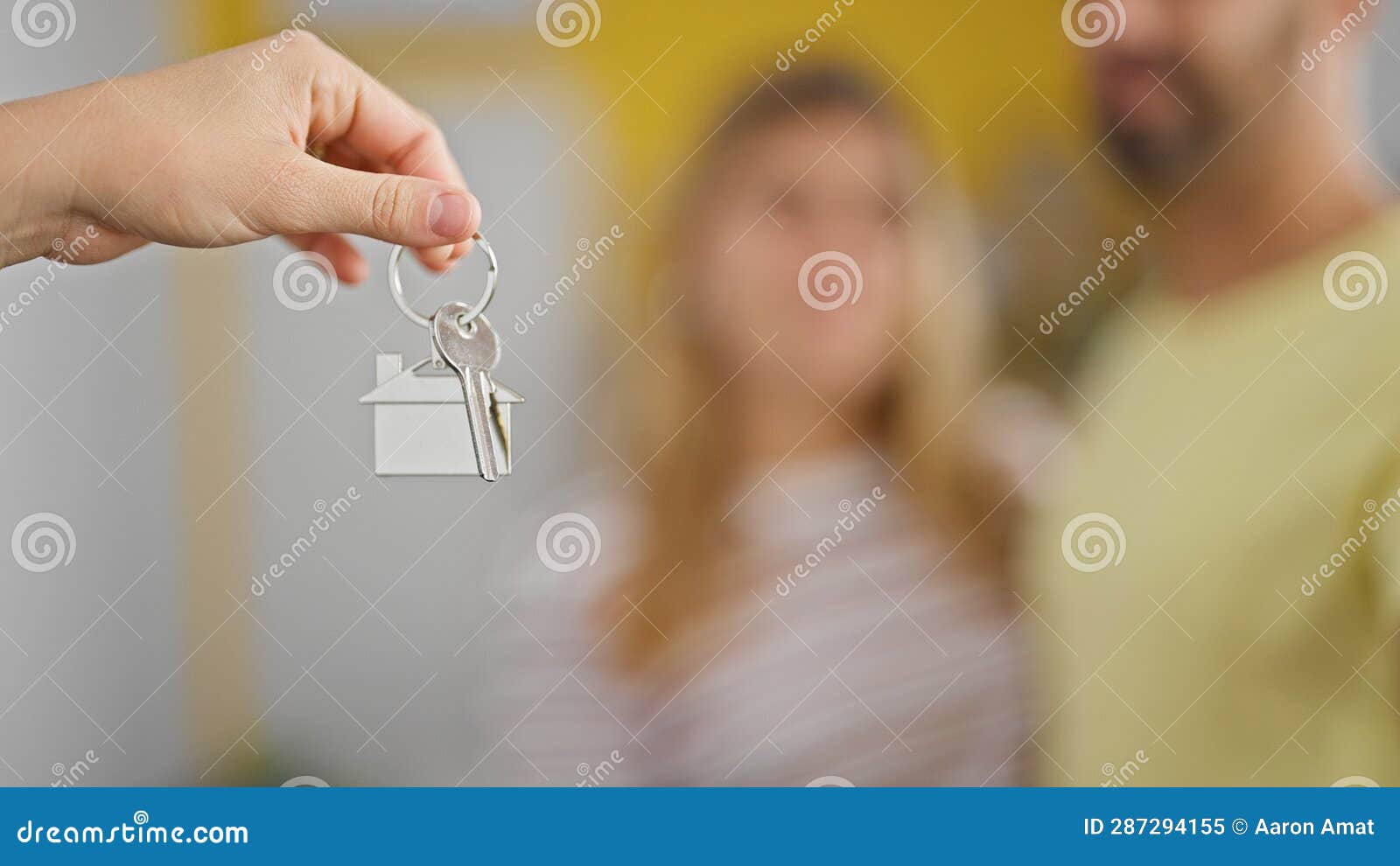 Man And Woman Couple Hugging Each Other Receiving New House Keys At New