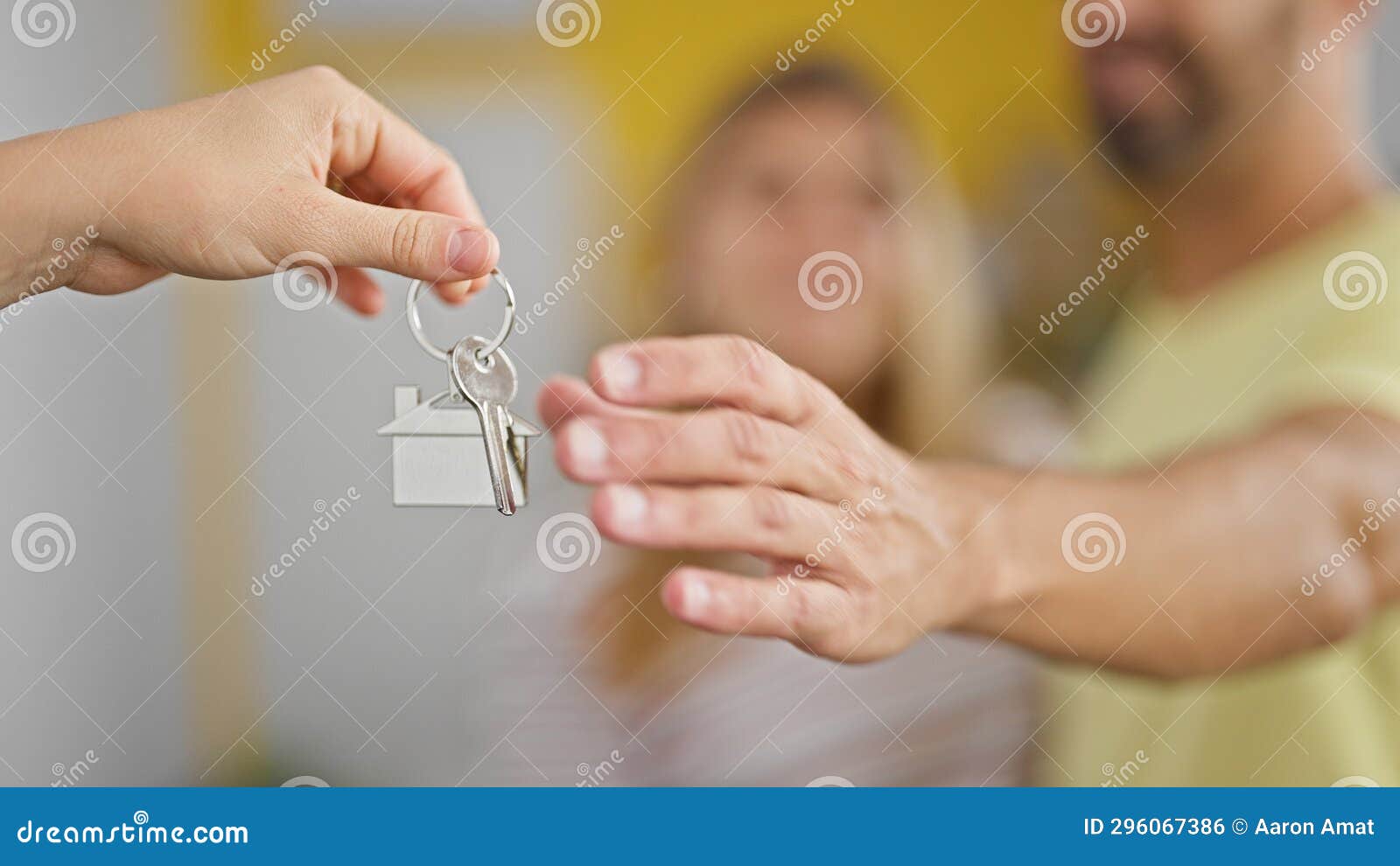 Man And Woman Couple Hugging Each Other Receiving New House Keys At New