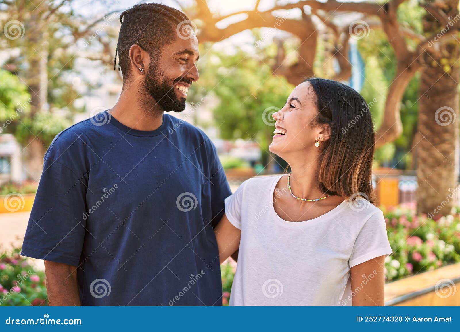 Man And Woman Couple Smiling Confident Hugging Each Other At Park Stock