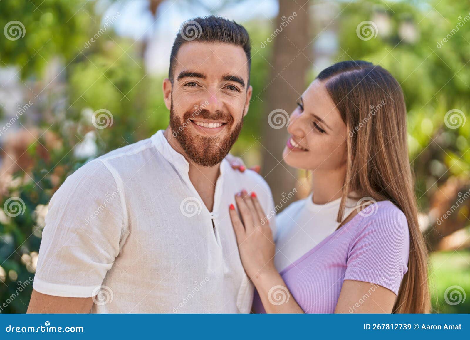 Man And Woman Couple Smiling Confident Hugging Each Other At Park Stock