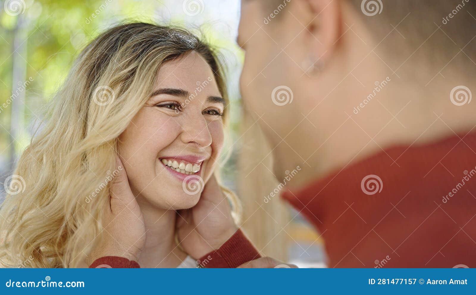 Man And Woman Couple Smiling Confident Hugging Each Other At Park Stock