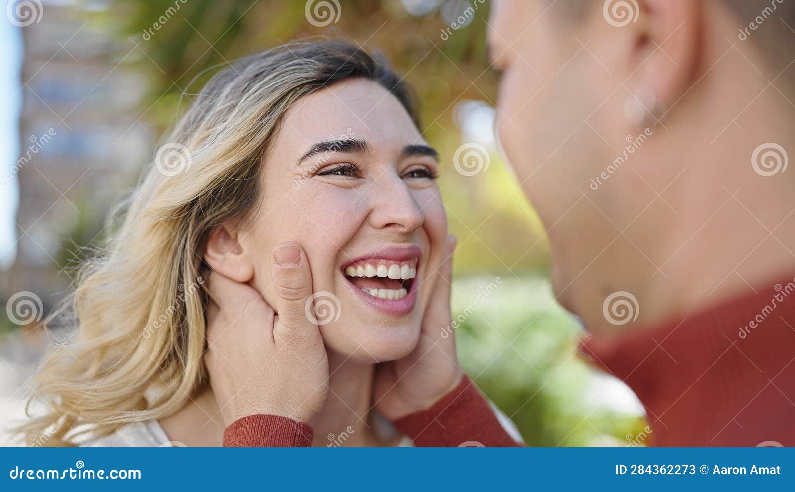 Man And Woman Couple Smiling Confident Hugging Each Other At Park Stock