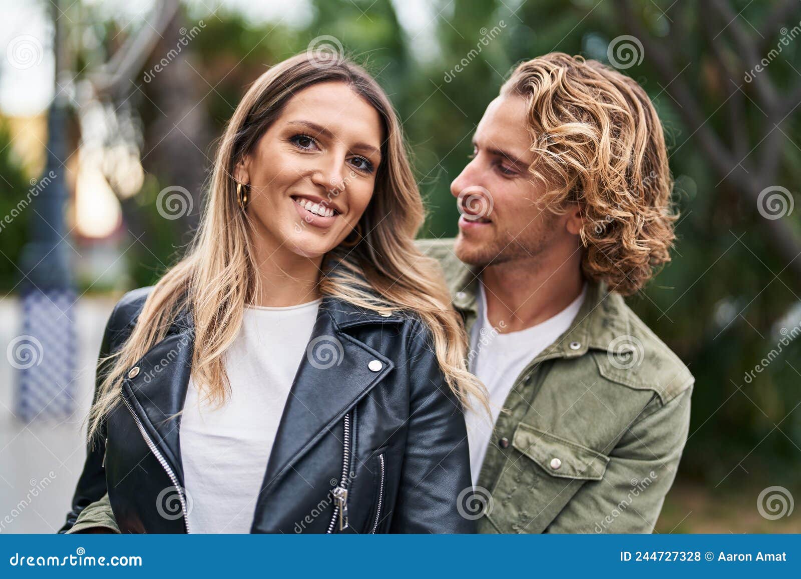 Man And Woman Couple Smiling Confident Hugging Each Other At Park Stock