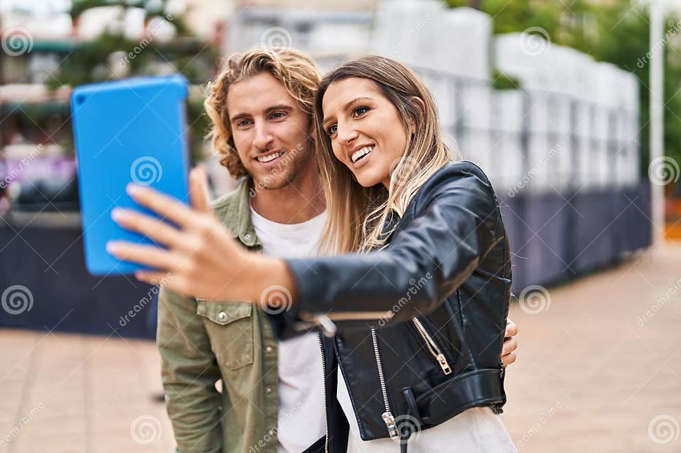 Man And Woman Couple Smiling Confident Make Selfie By The Touchpad At