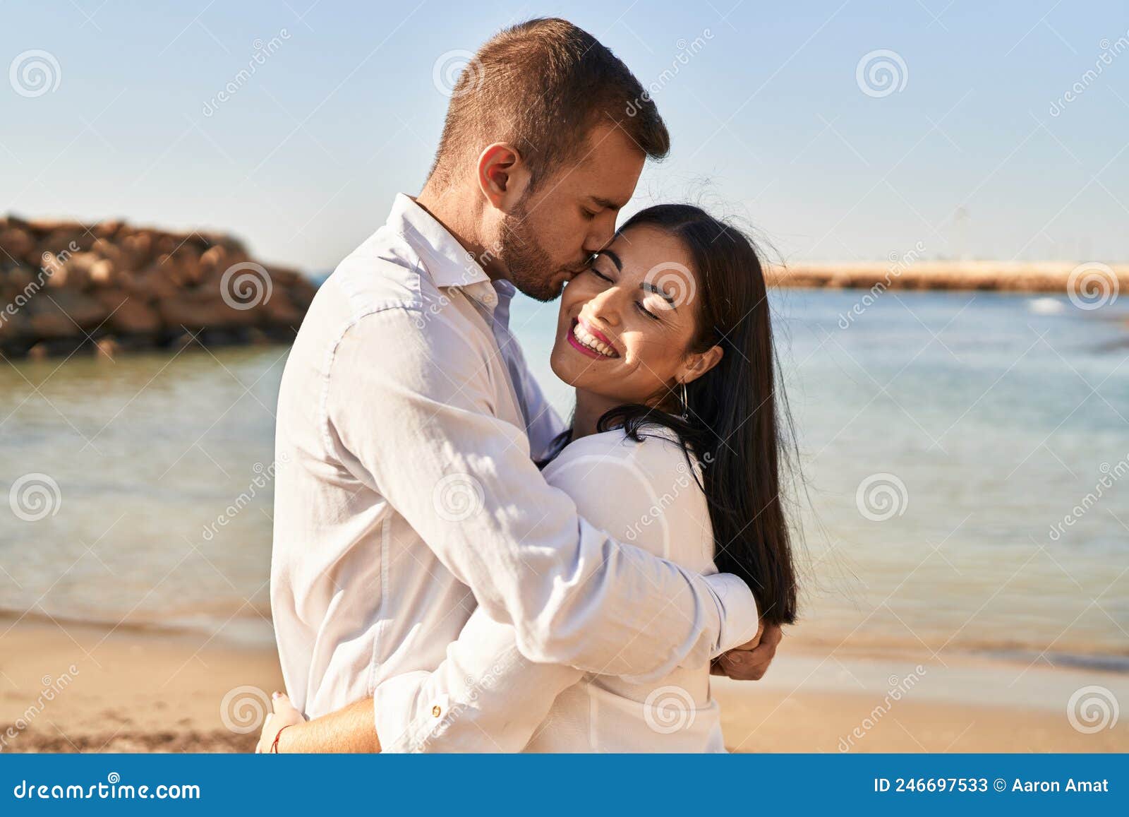 Man And Woman Couple Smiling Happy Hugging Each Other Standing At