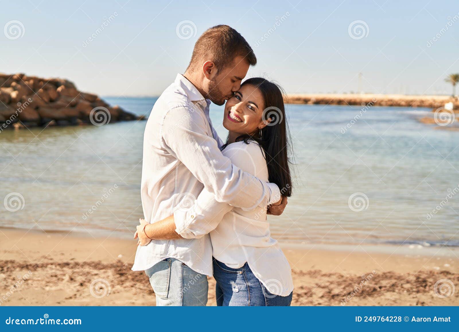 Man And Woman Couple Smiling Happy Hugging Each Other Standing At