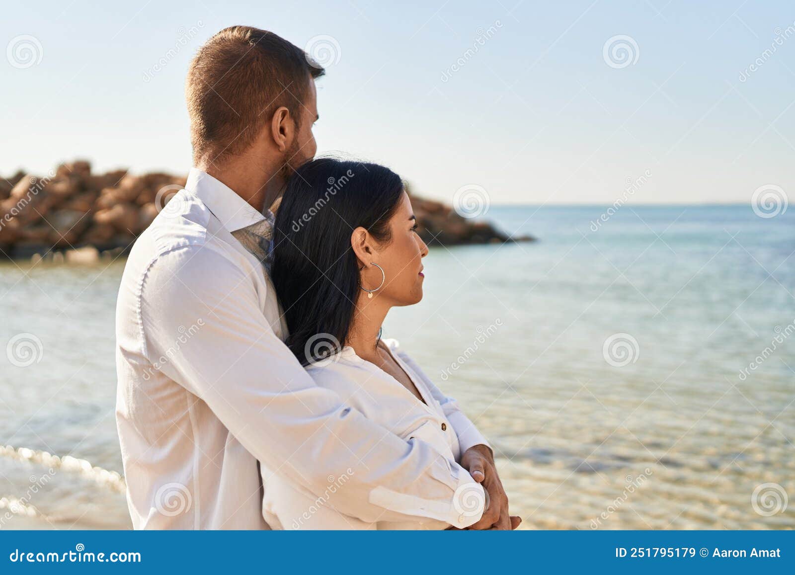 Man And Woman Couple Smiling Happy Hugging Each Other Standing At