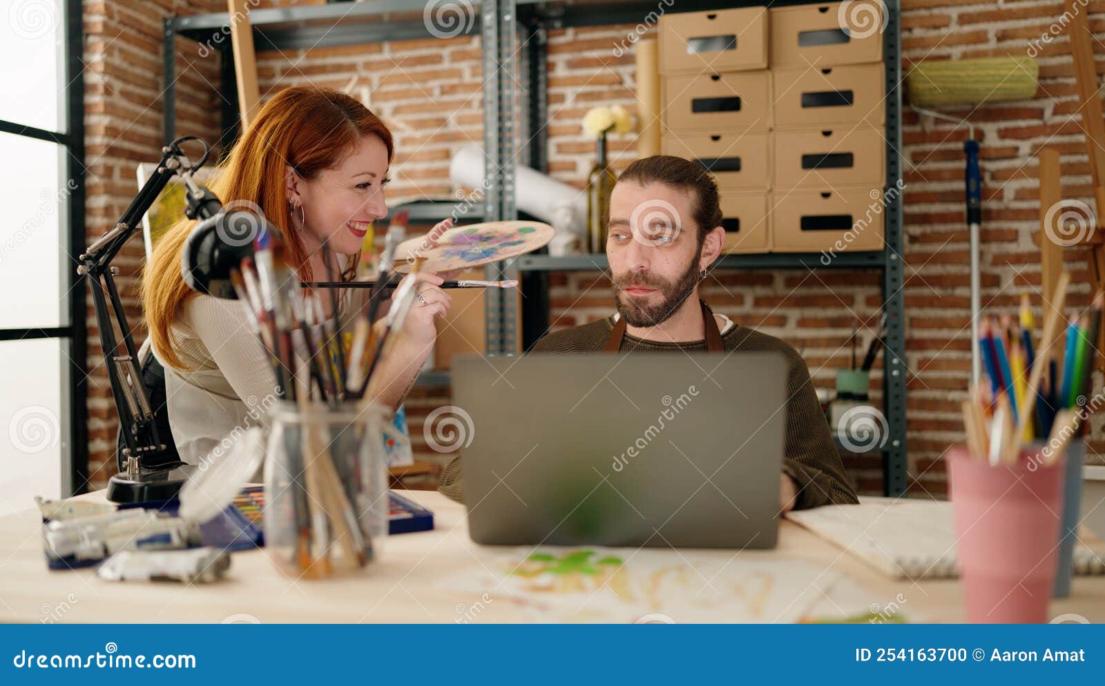 Man and Woman Couple Using Laptop and Drawing at Art Studio Stock Photo ...