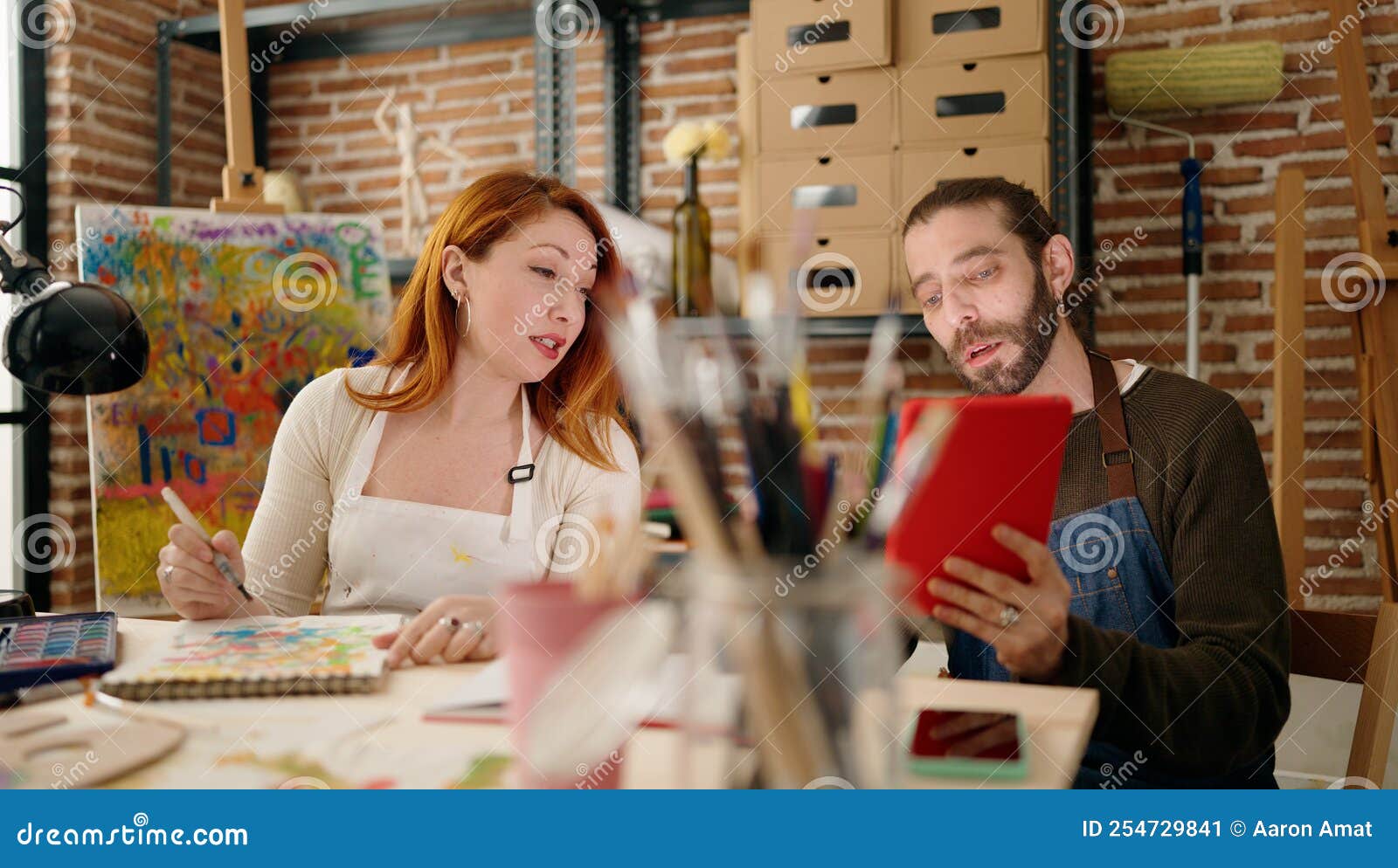 Man and Woman Couple Using Touchpad and Drawing at Art Studio Stock ...