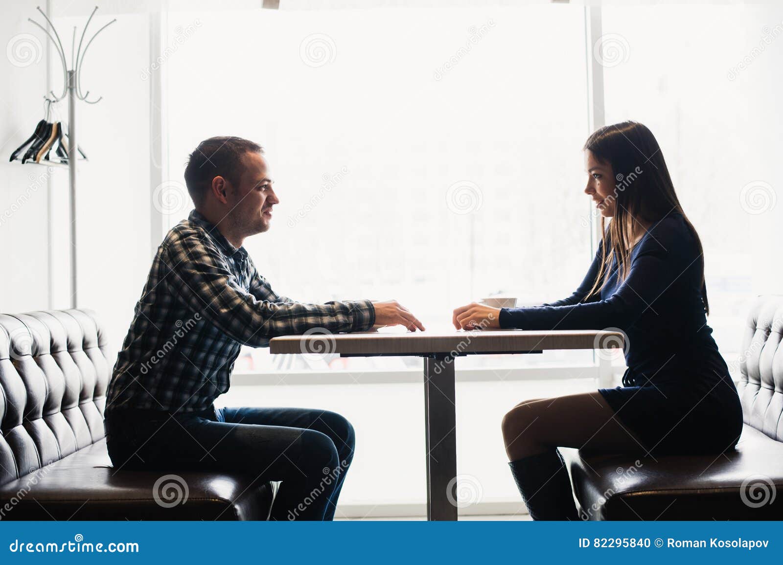 Man and Woman in Discussions in the Restaurant Stock Photo - Image of ...