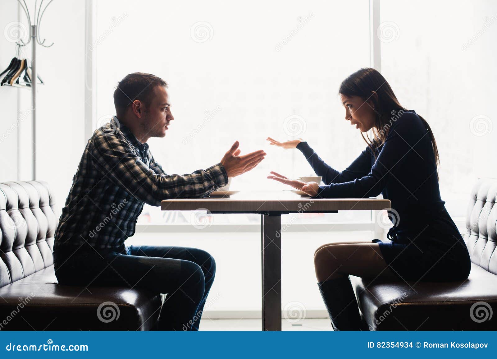 Man and Woman in Discussions in the Restaurant Stock Photo - Image of ...