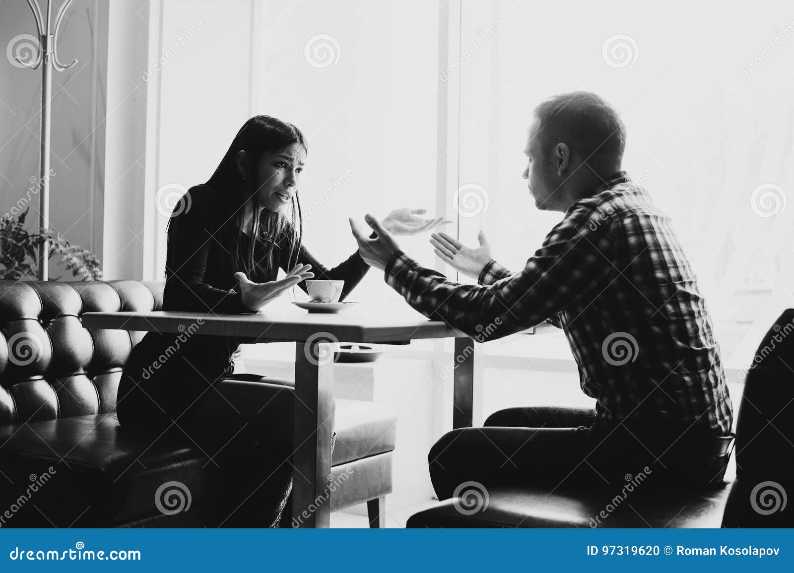 Man and Woman in Discussions in the Restaurant Stock Photo - Image of ...