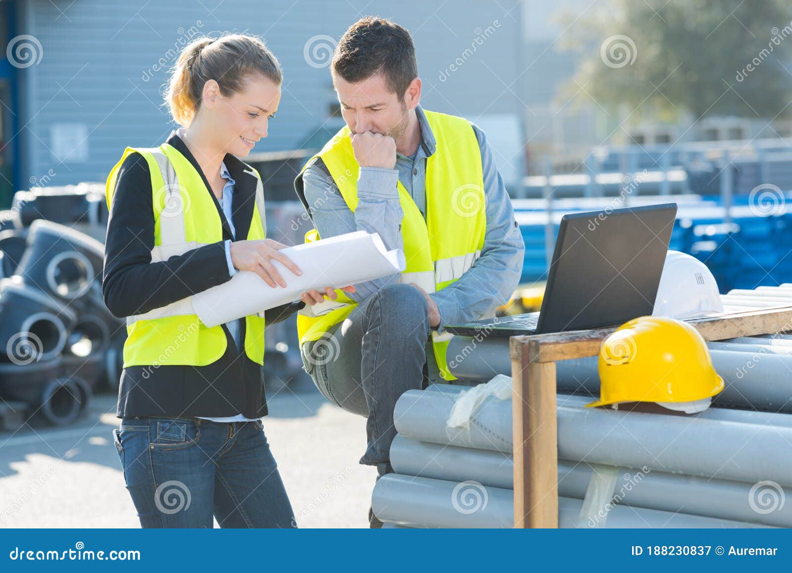 Man and Woman Engineers Checking Plans Stock Image - Image of engineer ...