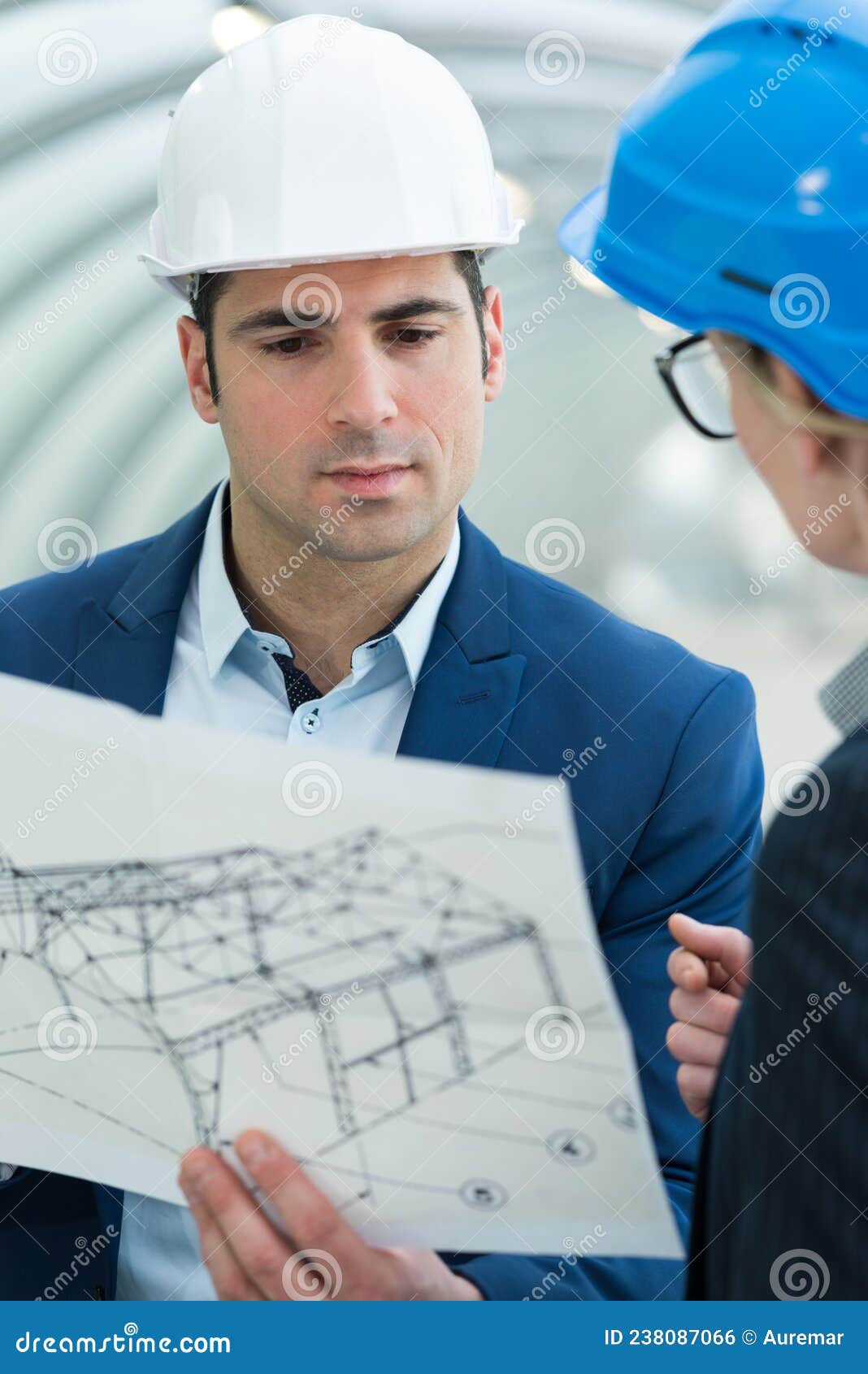 Man and Woman Examining Technical Drawing Stock Photo - Image of ...