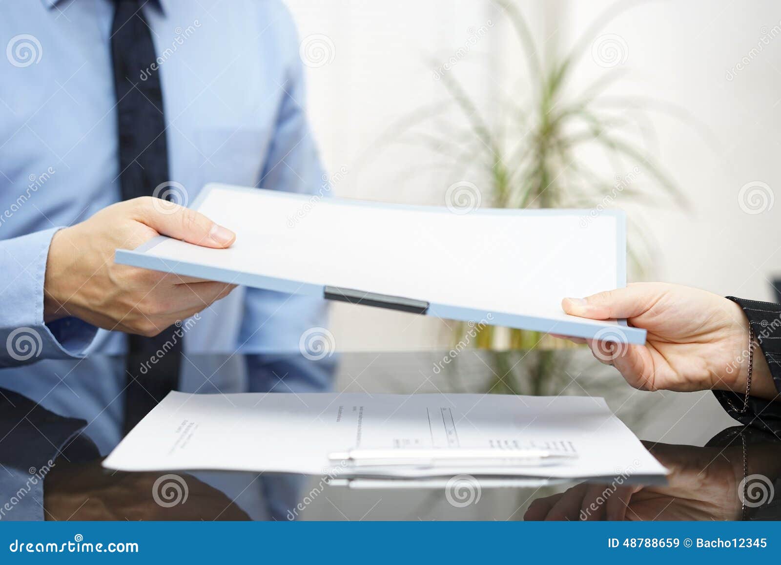 Man and Woman are Exchanging Contract or Document Stock Image - Image ...