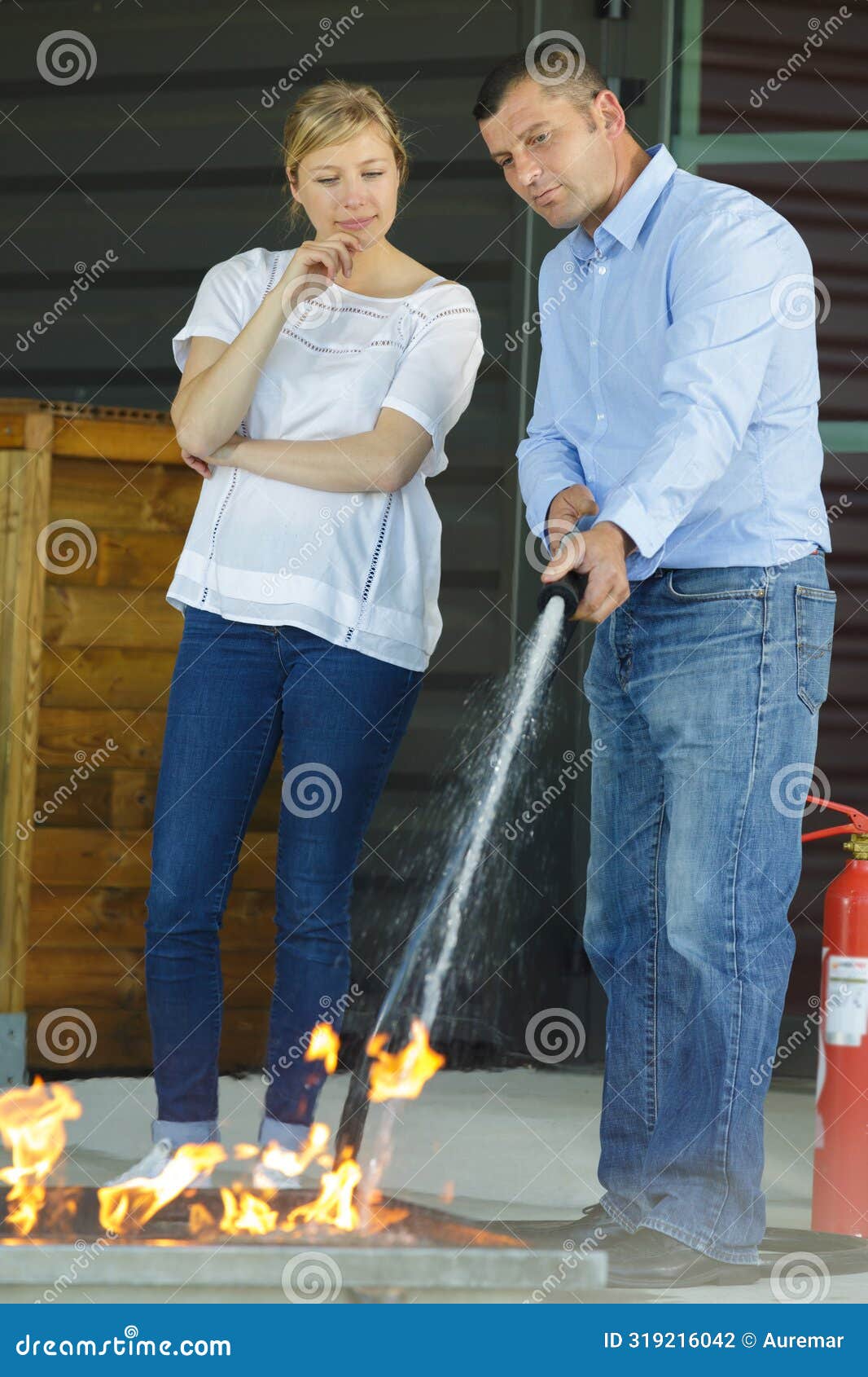 Man and Woman during Fire Safety Training Stock Photo - Image of ...
