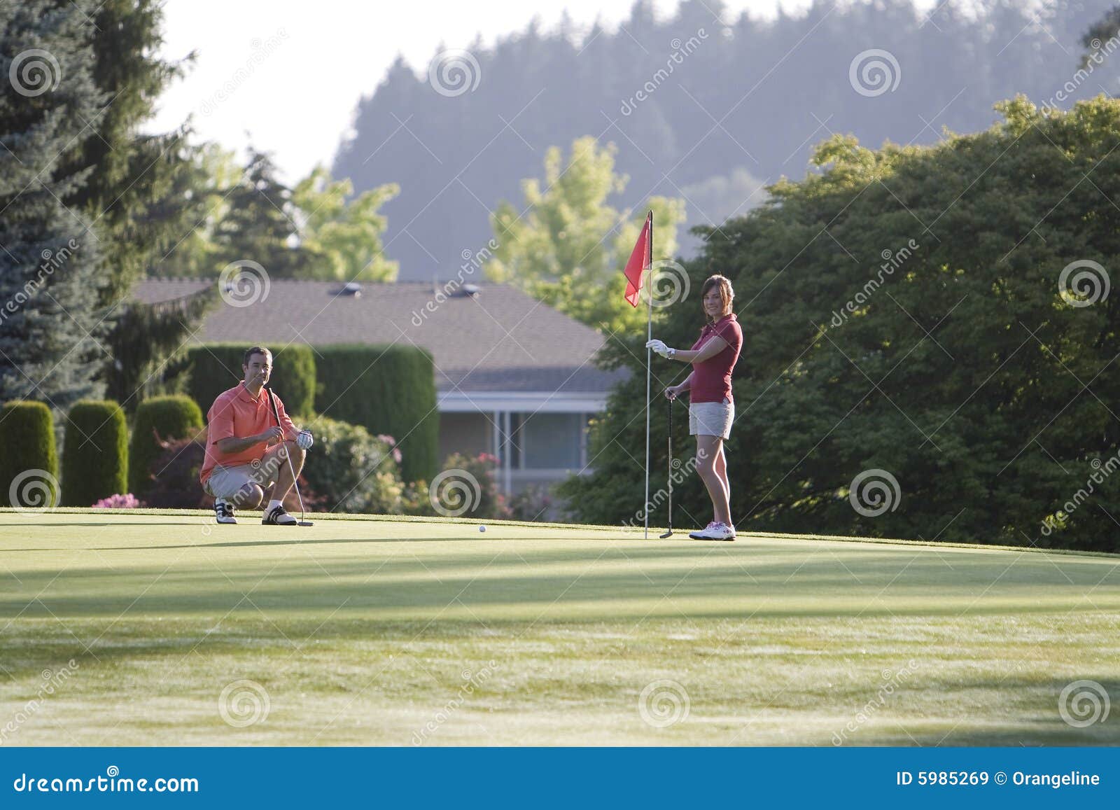 Man and Woman on Golf Course - Horizontal Stock Image - Image of chip ...