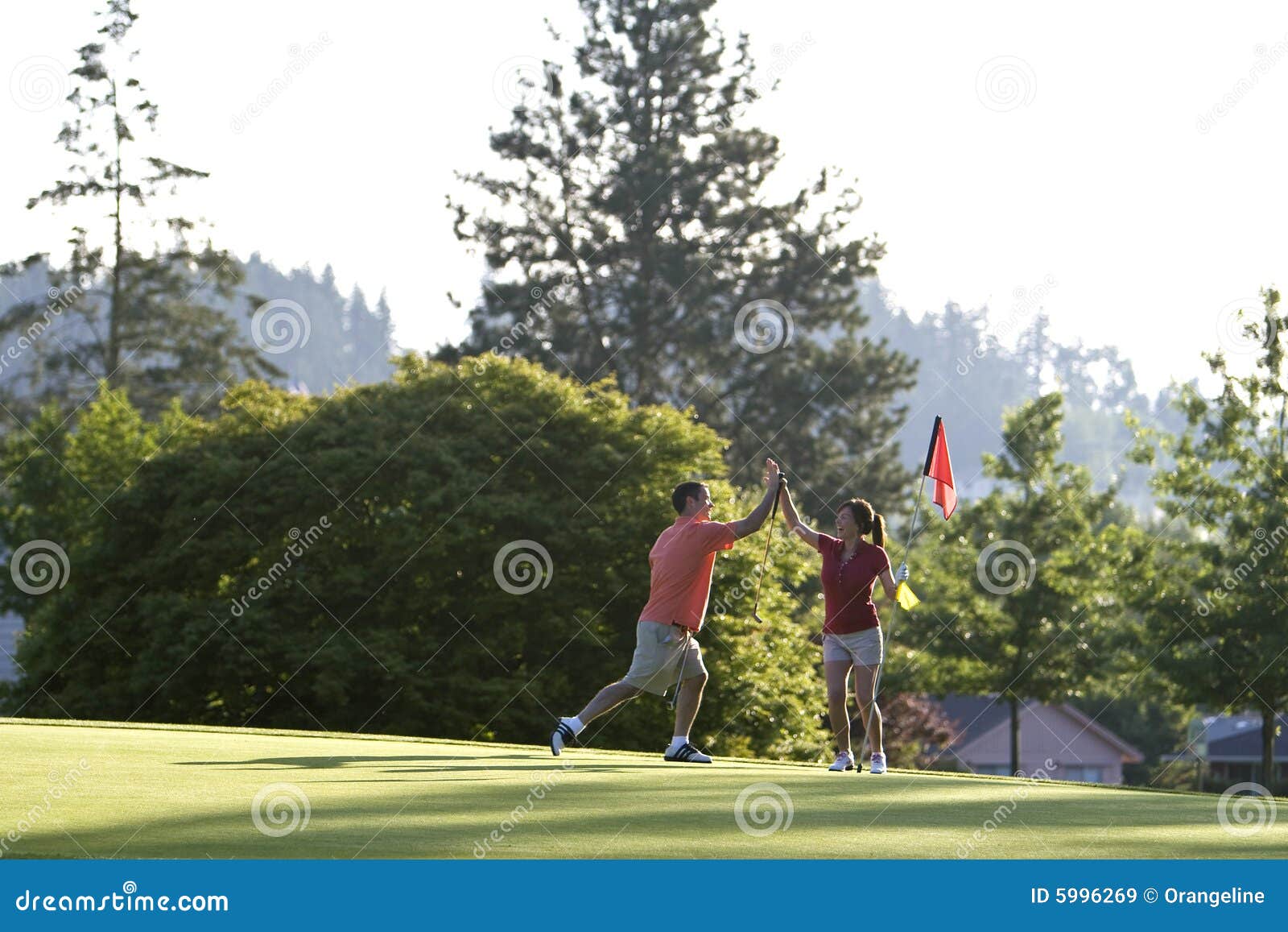 Man and Woman on Golf Course - Horizontal Stock Image - Image of ...