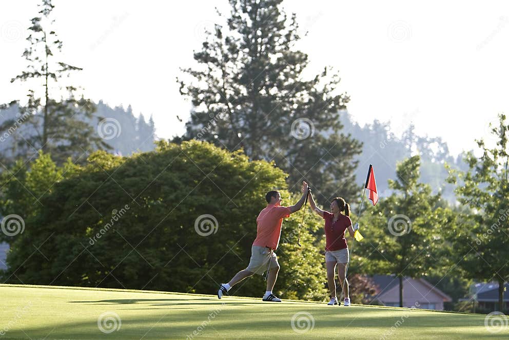 Man and Woman on Golf Course - Horizontal Stock Image - Image of ...