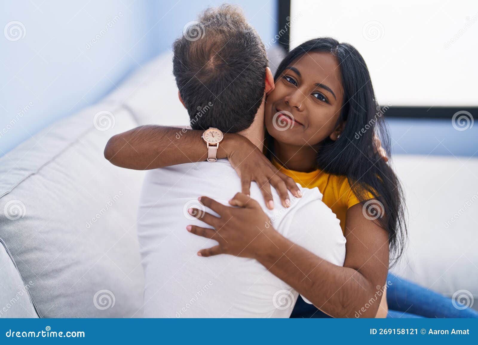 Man And Woman Interracial Couple Hugging Each Other At Home Stock Image