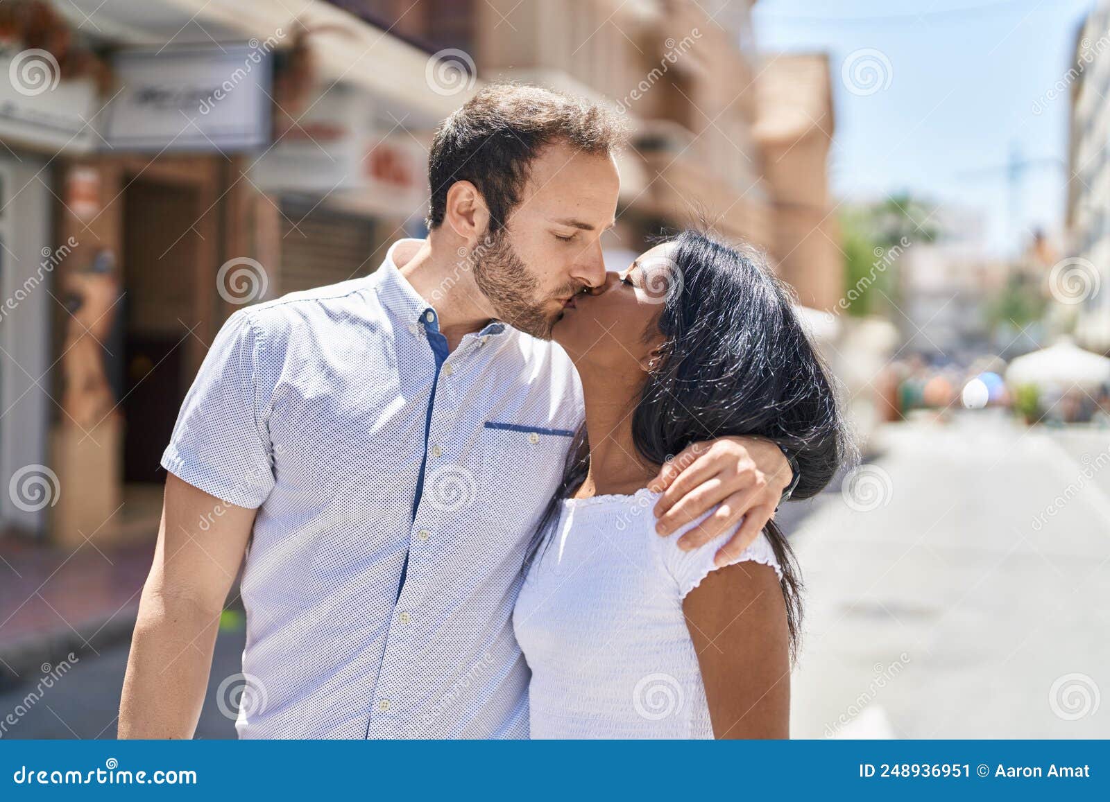 Man And Woman Interracial Couple Hugging Each Other And Kissing At