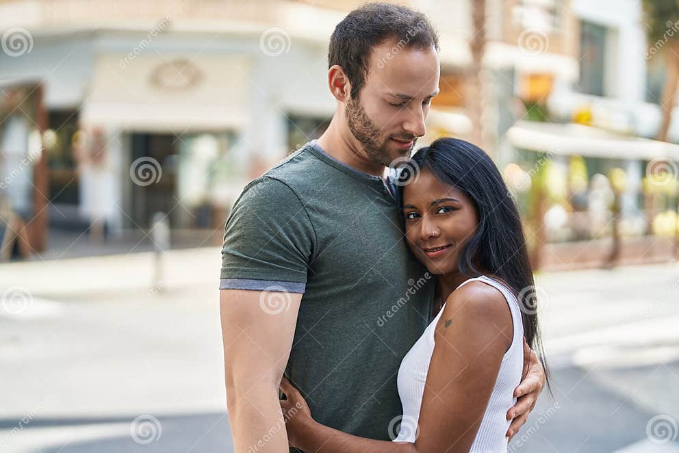Man And Woman Interracial Couple Hugging Each Other At Street Stock