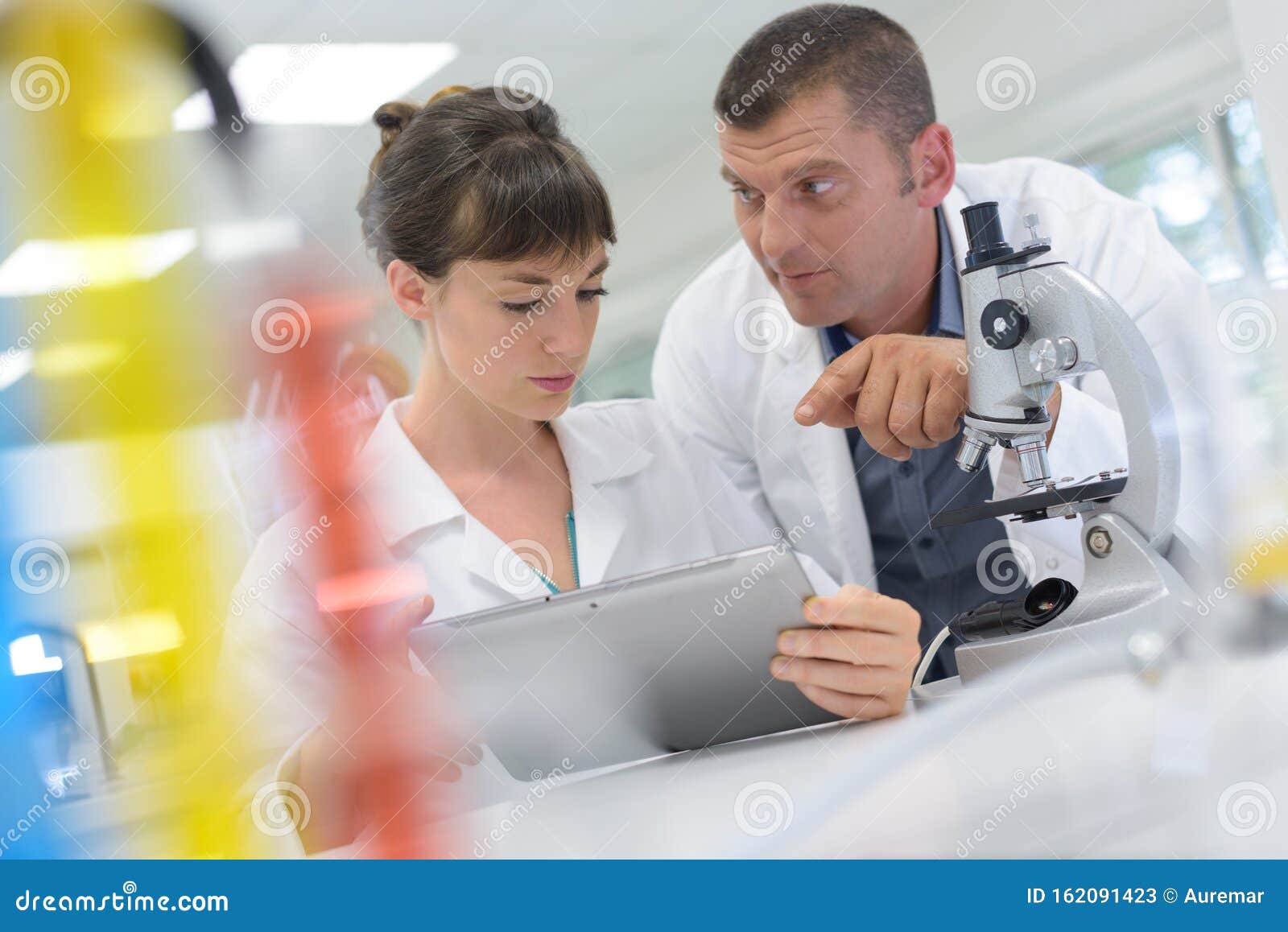 Man and Woman in Lab Using Tablet Stock Image - Image of keyboard ...