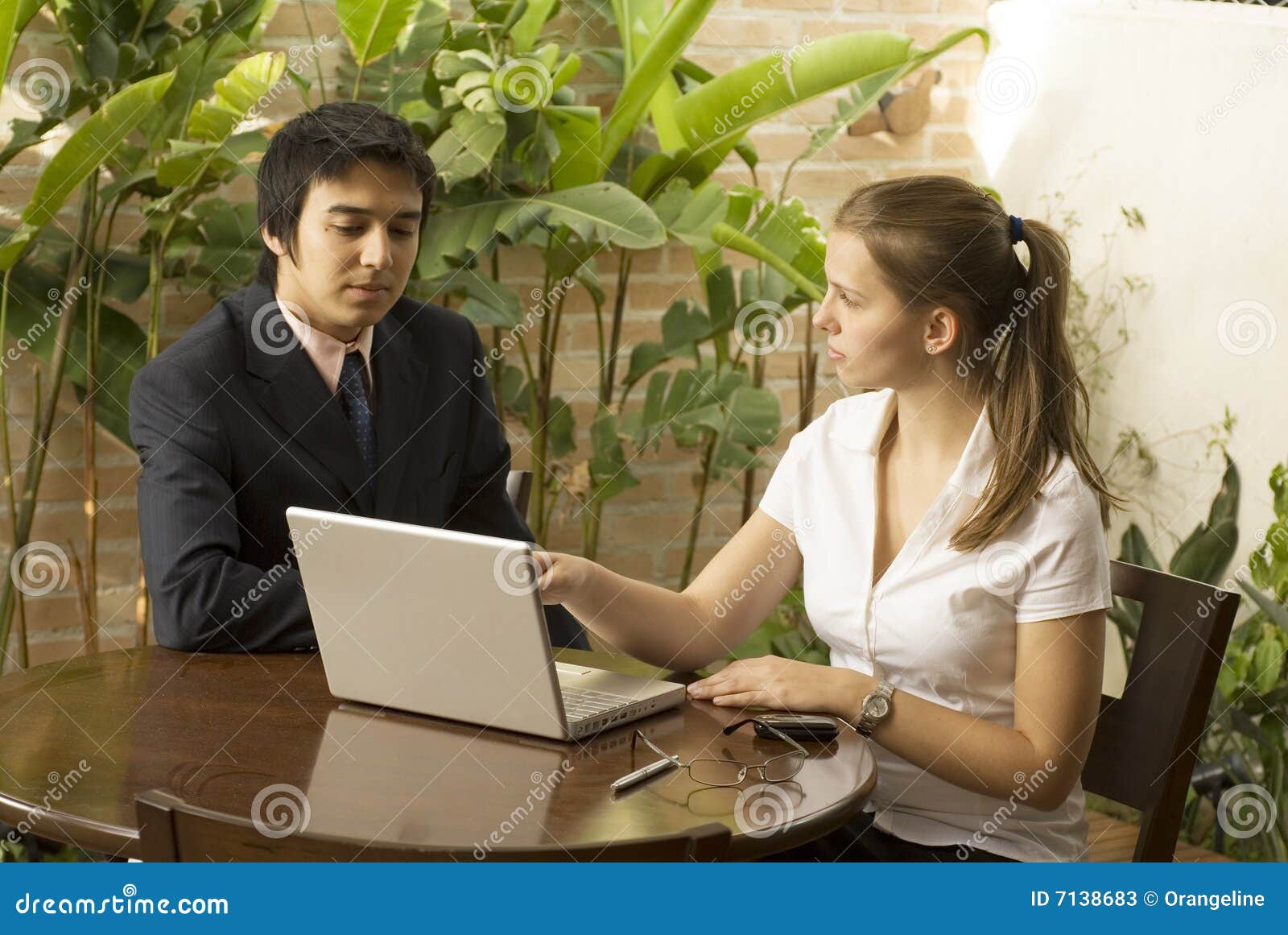 Man and Woman with Laptop stock image. Image of mixed - 7138683