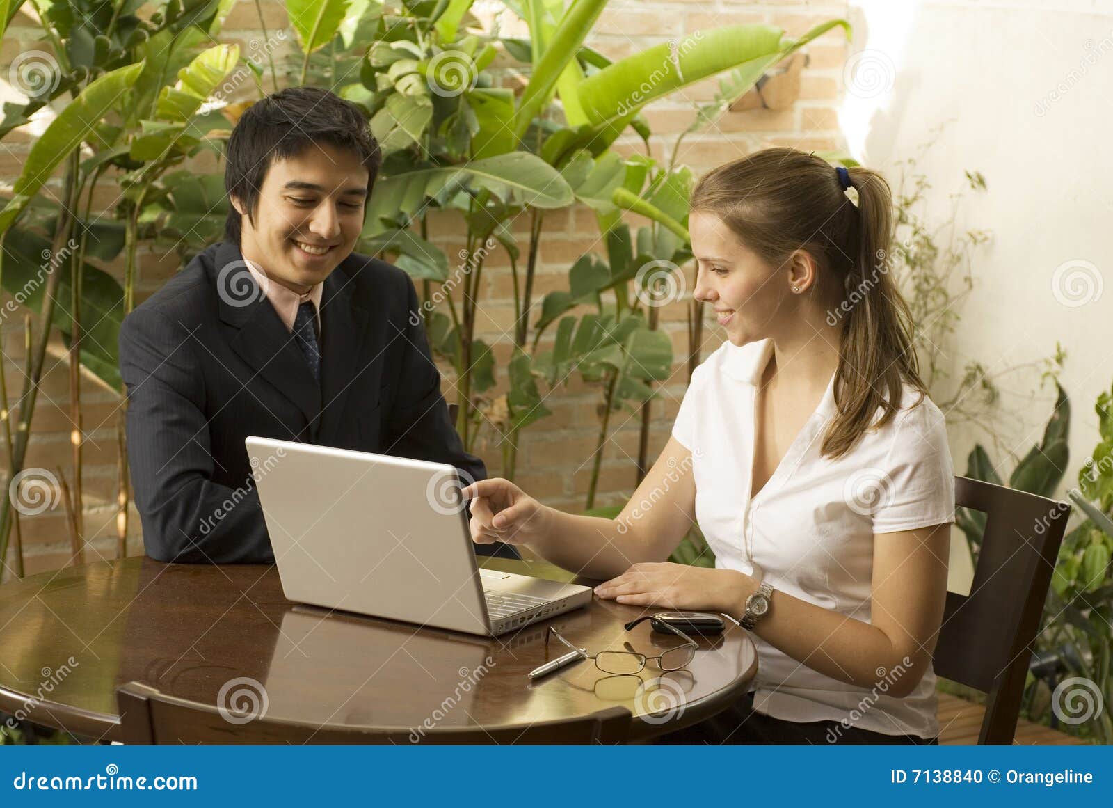 Man and Woman with Laptop stock photo. Image of mixed - 7138840