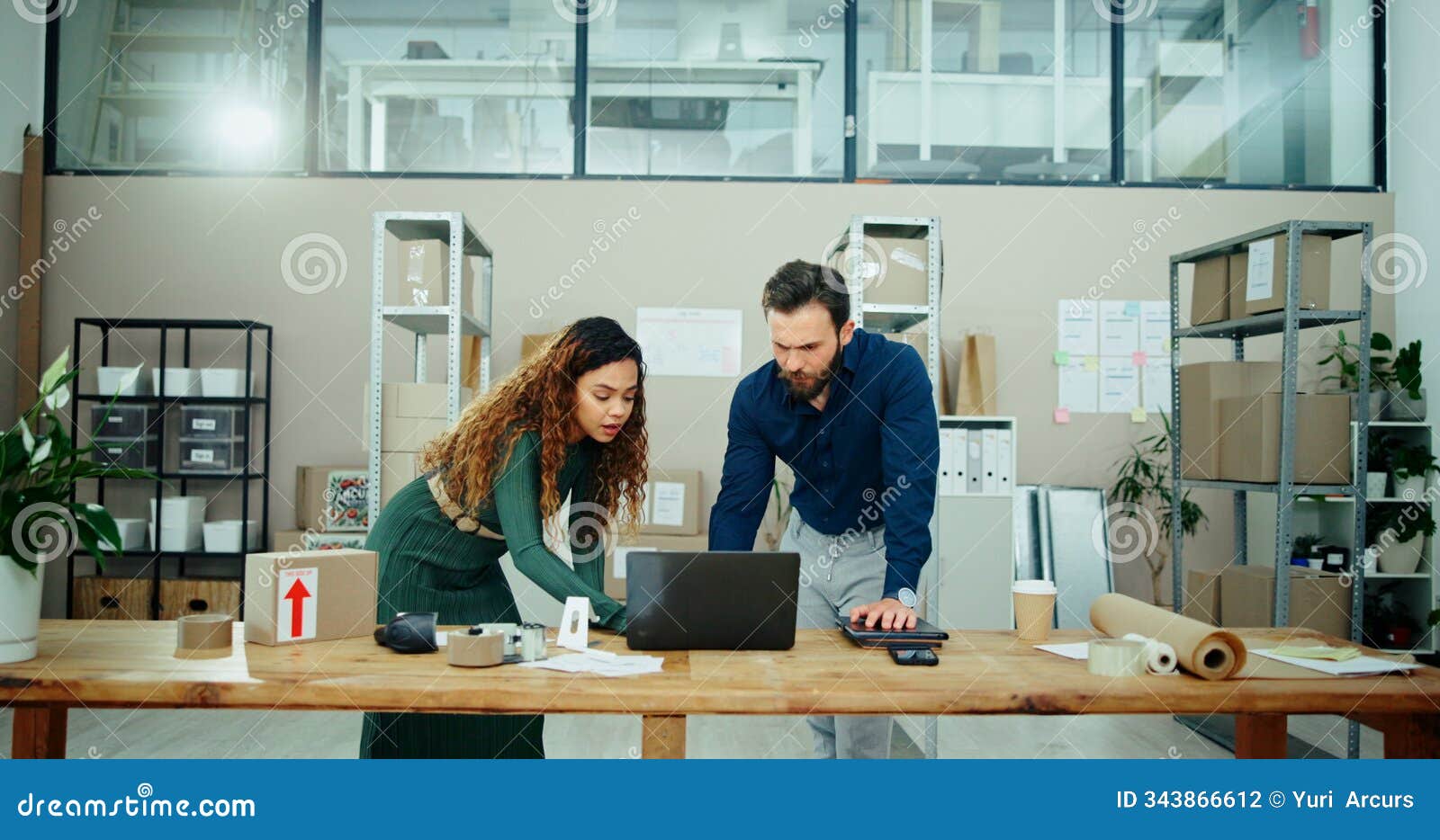 Man, Woman and Laptop in Warehouse, Boxes and Problem Solving with ...