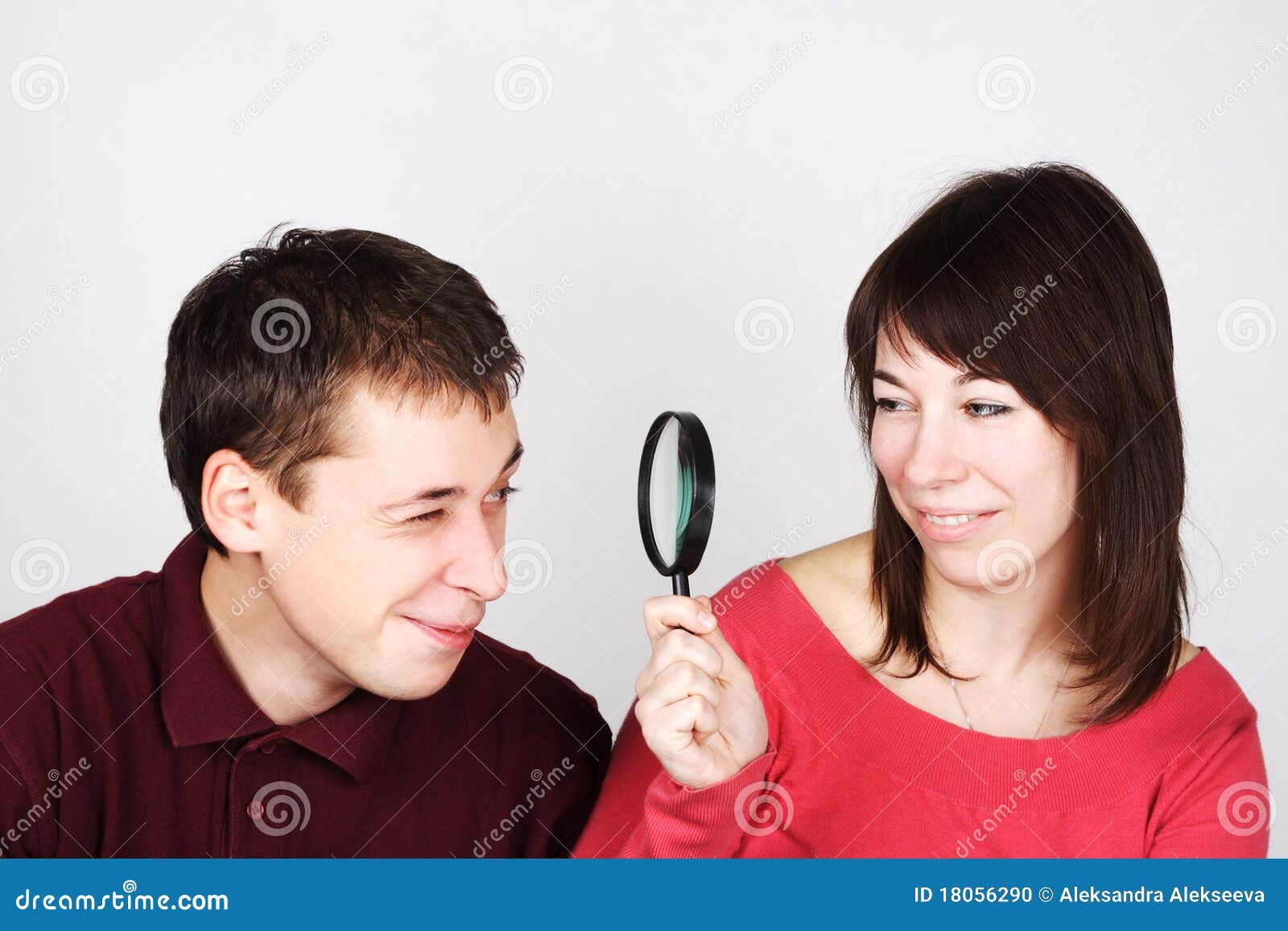 Man and Woman Looking through Magnifier Stock Photo - Image of ...