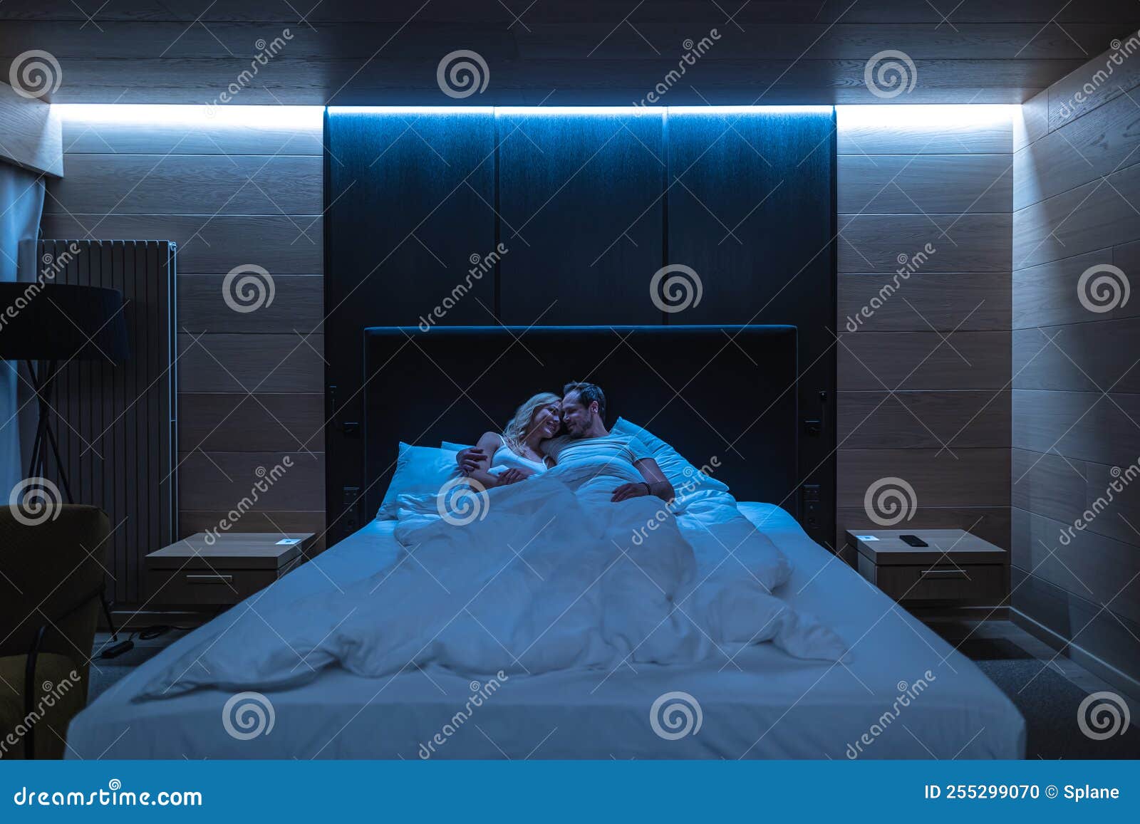 The Man and Woman Lying in Bed in a Hotel Room. Stock Photo - Image of ...