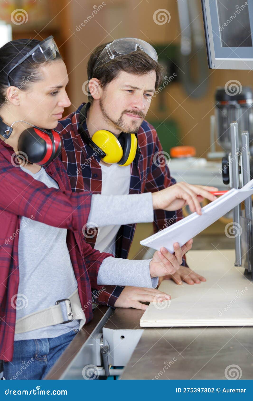 Man and Woman with Machine and Paperwork Stock Photo - Image of ...