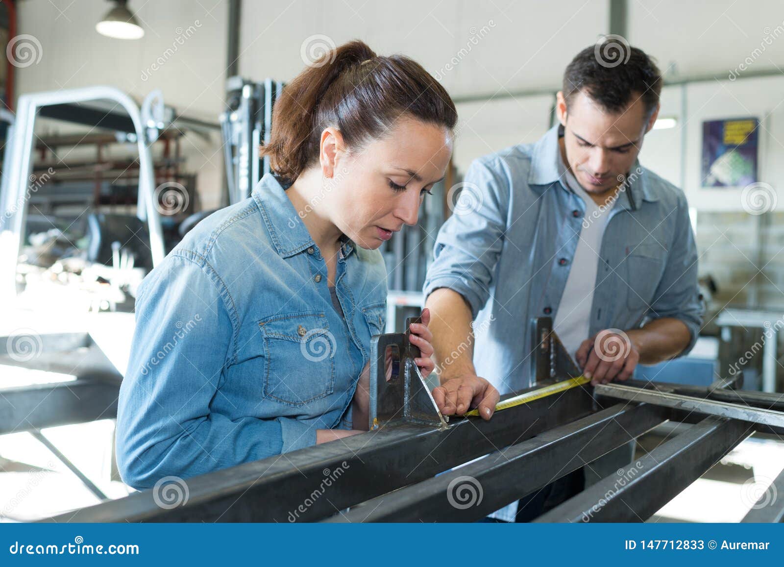Man and Woman Measuring Length Metal in Workshop Stock Image - Image of ...