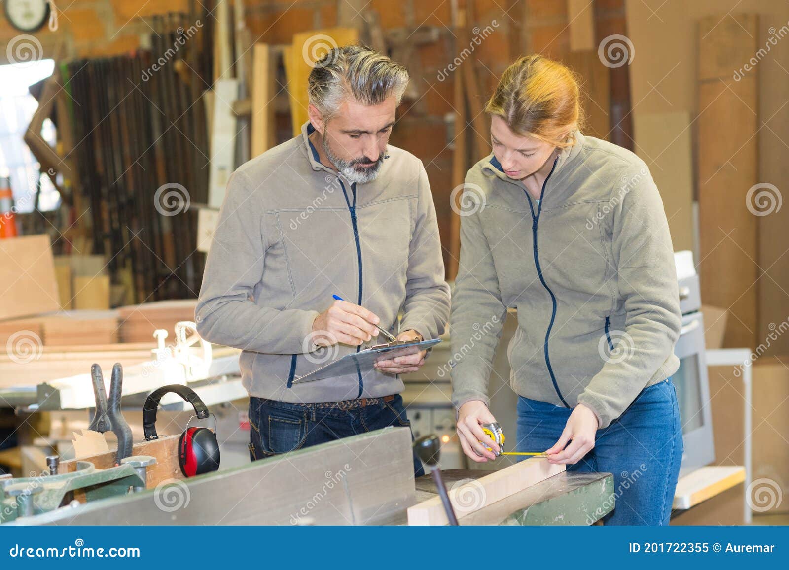 Man and Woman Measuring Wood in Woodworking Studio Stock Image - Image ...