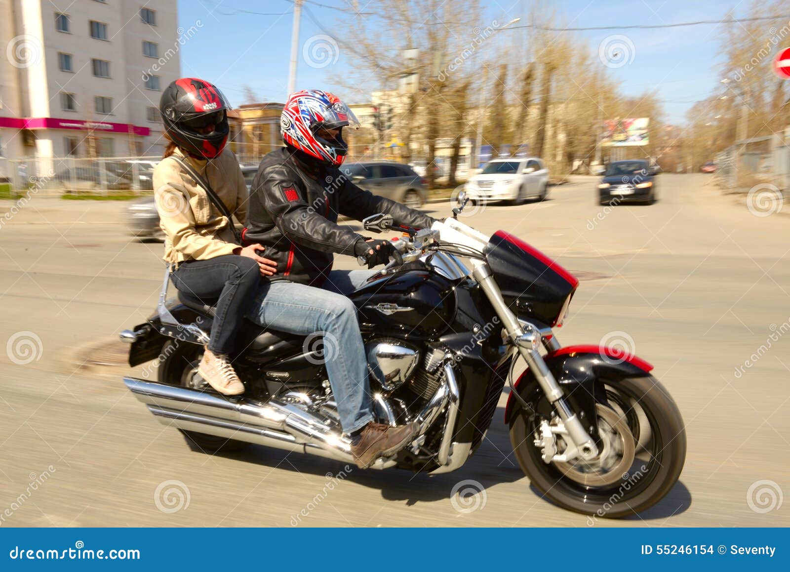 Man On Motorcycle And Woman With Baby In Village In Southern Spain Off ...