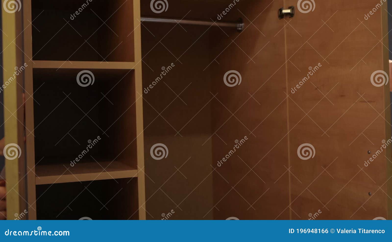 A Man and a Woman Open the Cupboard Doors, Inside Empty Shelves for ...