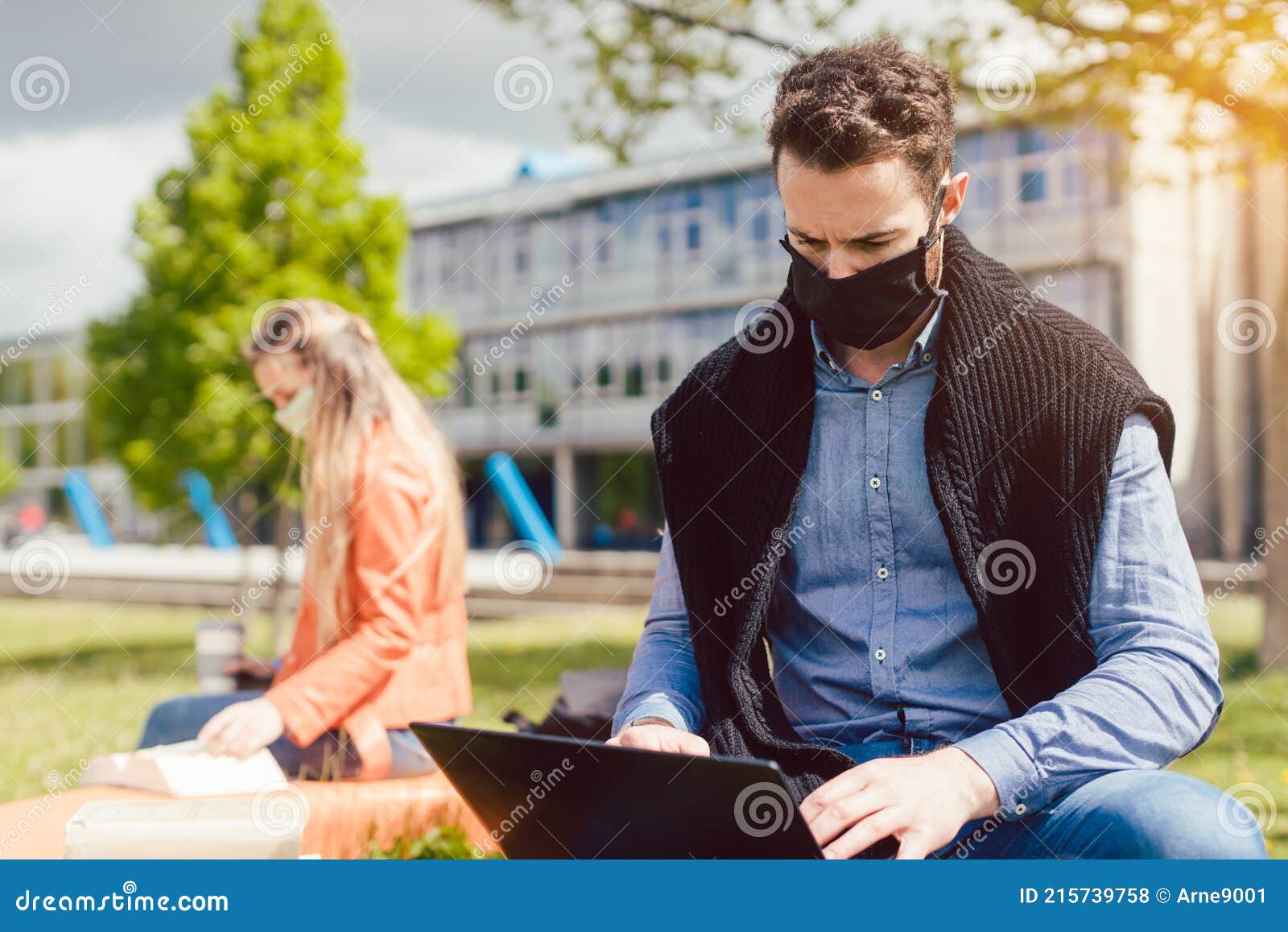 Man and Woman Practicing Social Distancing in University Stock Photo ...