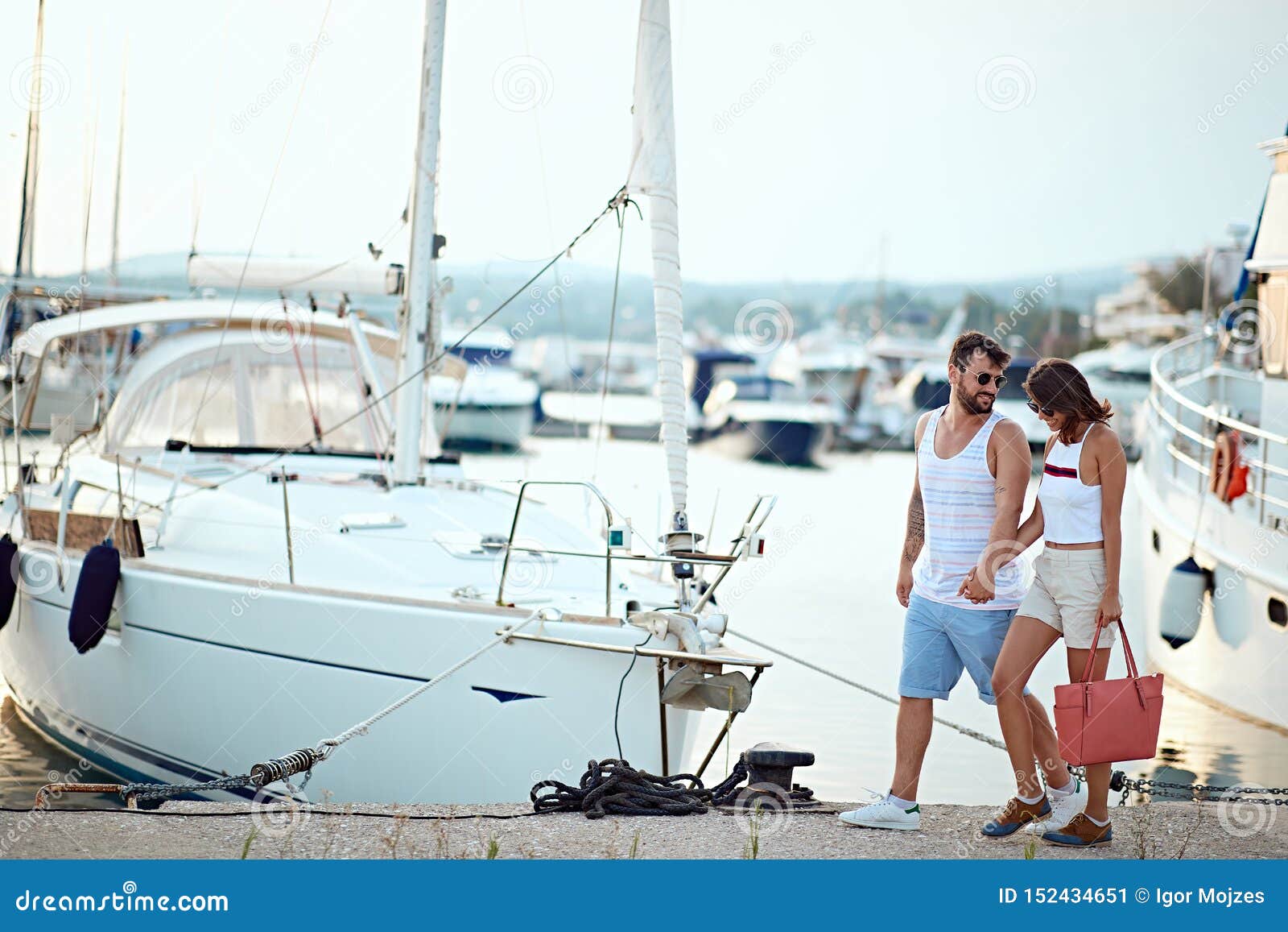 Man and Woman on Romantic Walking on the Dock at Sunset Stock Image ...