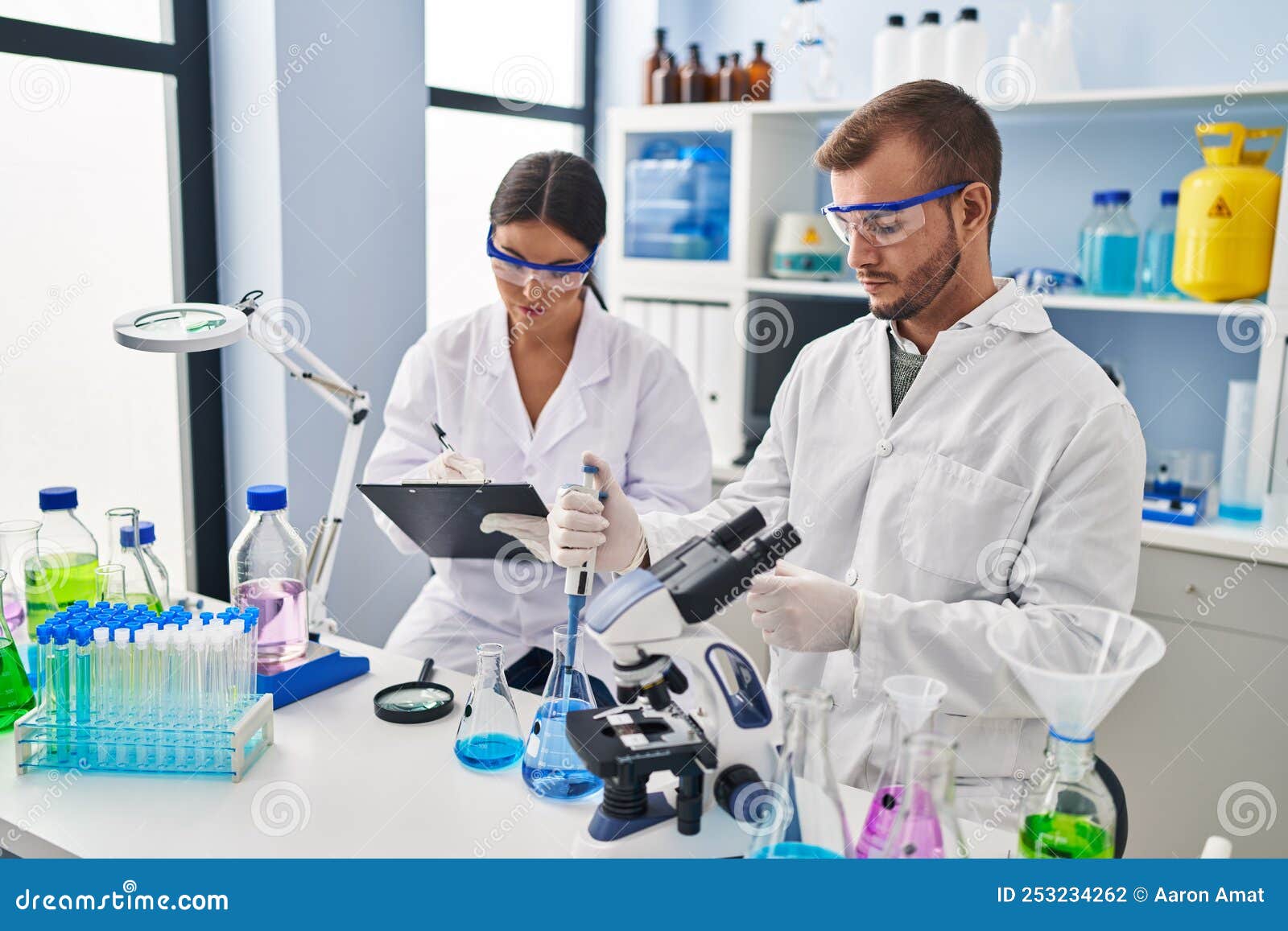 Man and Woman Scientist Partners Working at Laboratory Stock Photo ...