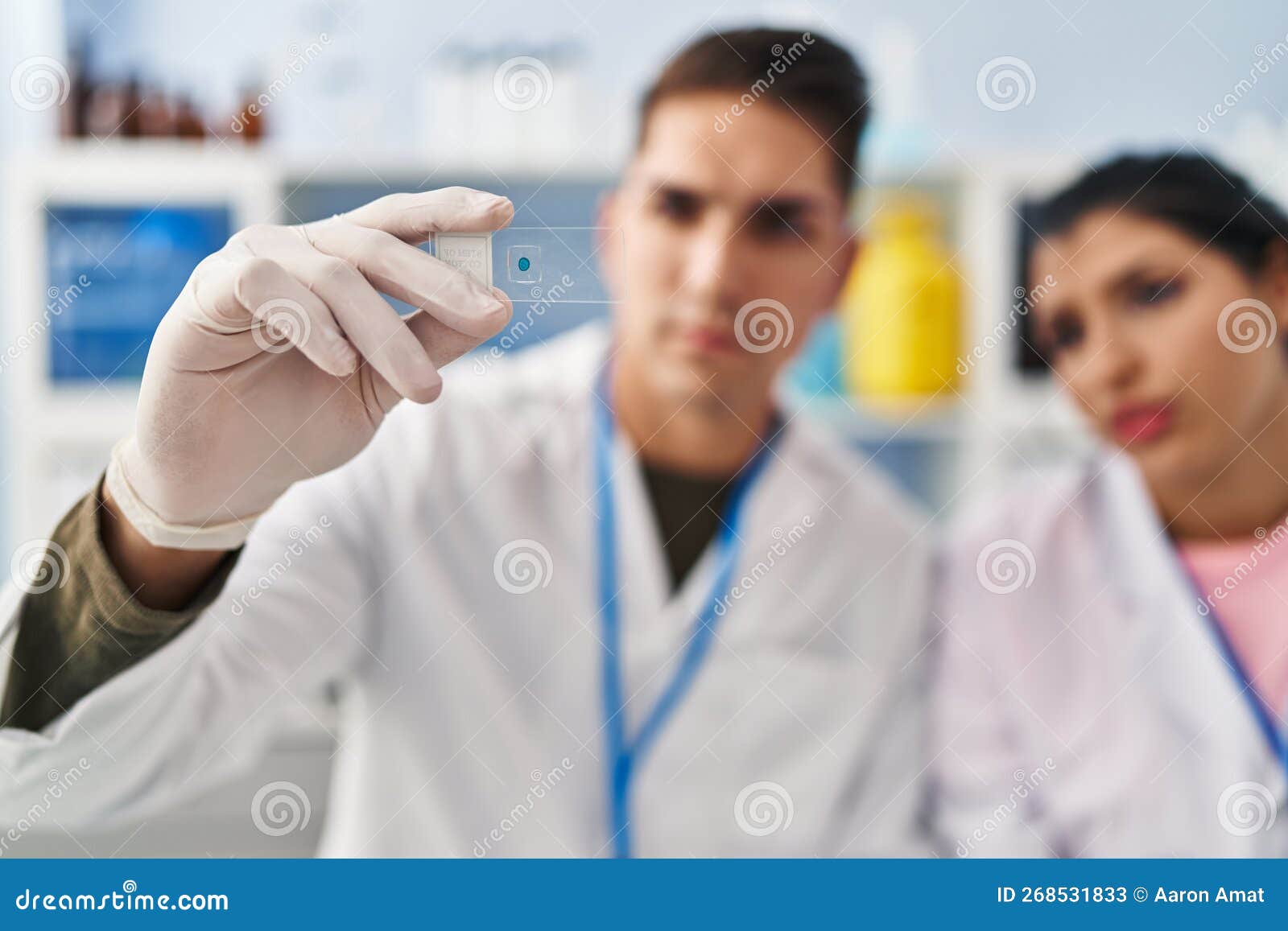 Man and Woman Scientists Partners Analysing Sample at Laboratory Stock ...