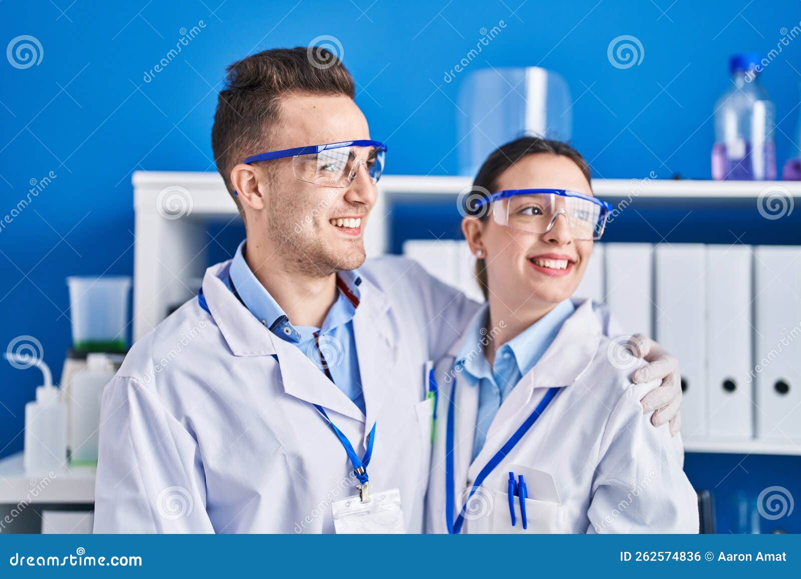 Man and Woman Scientists Smiling Confident Hugging Each Other at ...