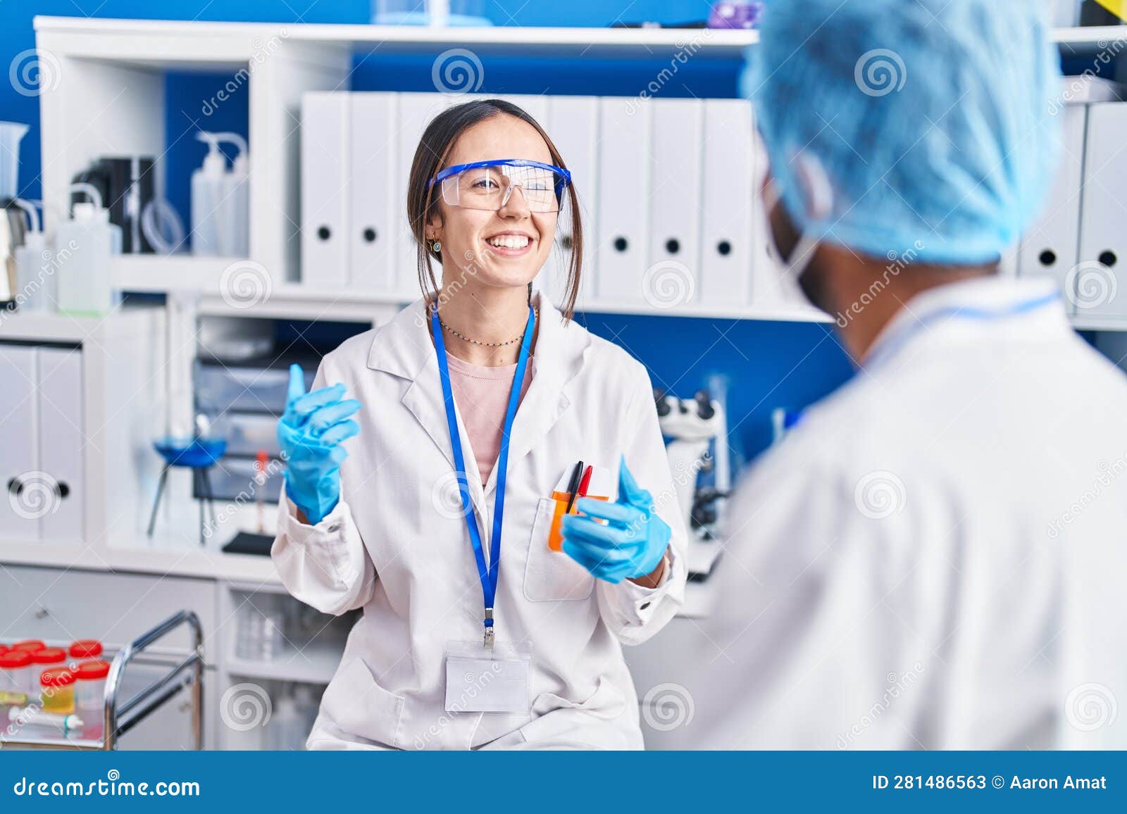 Man and Woman Scientists Smiling Confident Speaking at Laboratory Stock ...