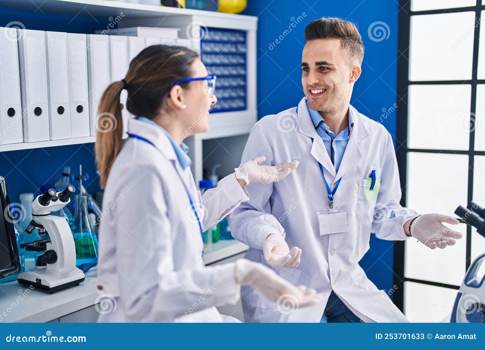 Man and Woman Scientists Speaking at Laboratory Stock Image - Image of ...
