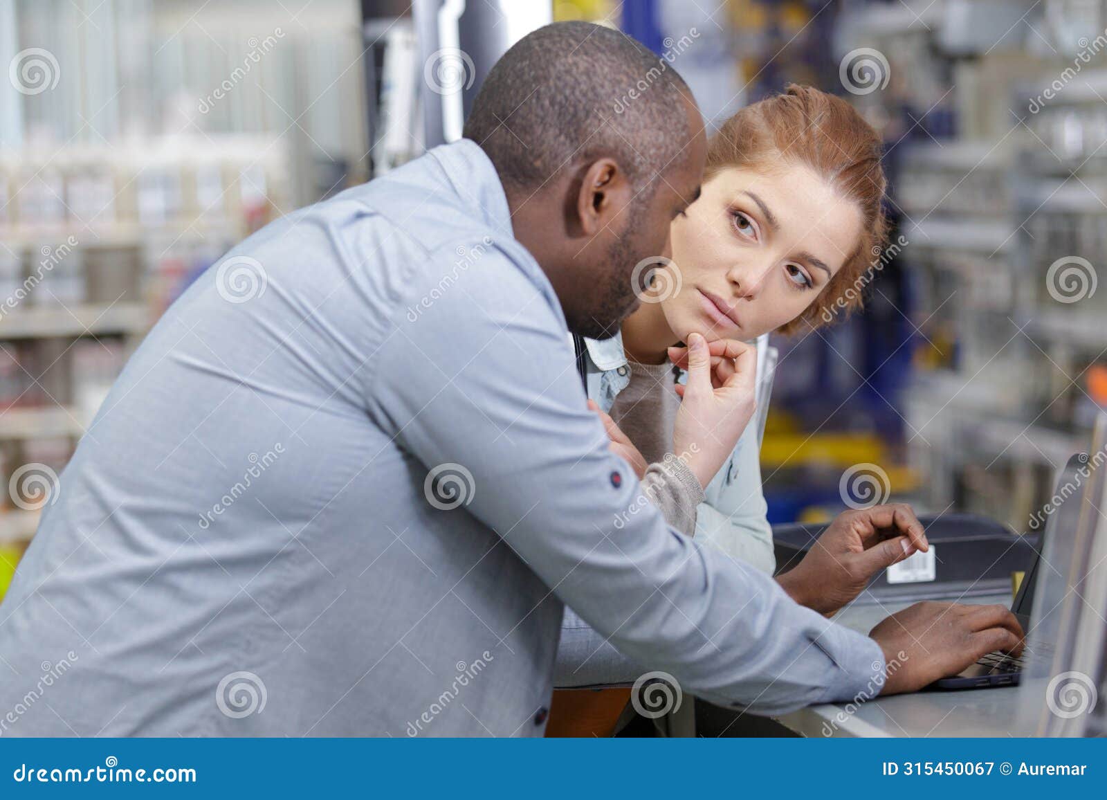 Man and Woman in Serious Conversation in Hardware Store Stock Image ...