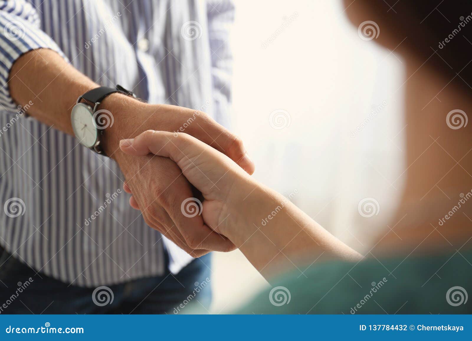 Man and Woman Shaking Hands on Light Background. Help and Support ...