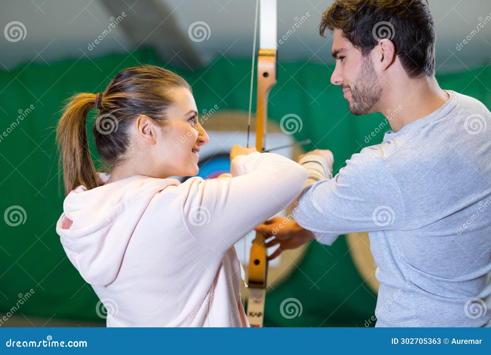 Man and Woman Shooting with Bows Practicing Archery Stock Image - Image ...